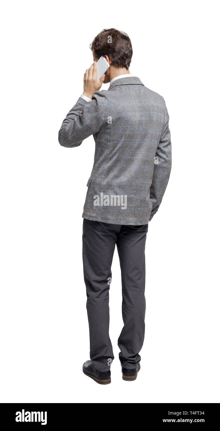 back view of business man in suit talking on mobile phone. rear view ...