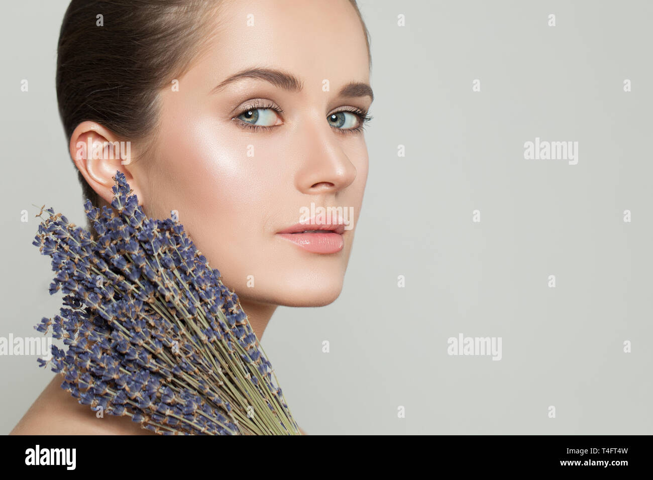 Perfect model with lavender flowers and clear skin Stock Photo - Alamy