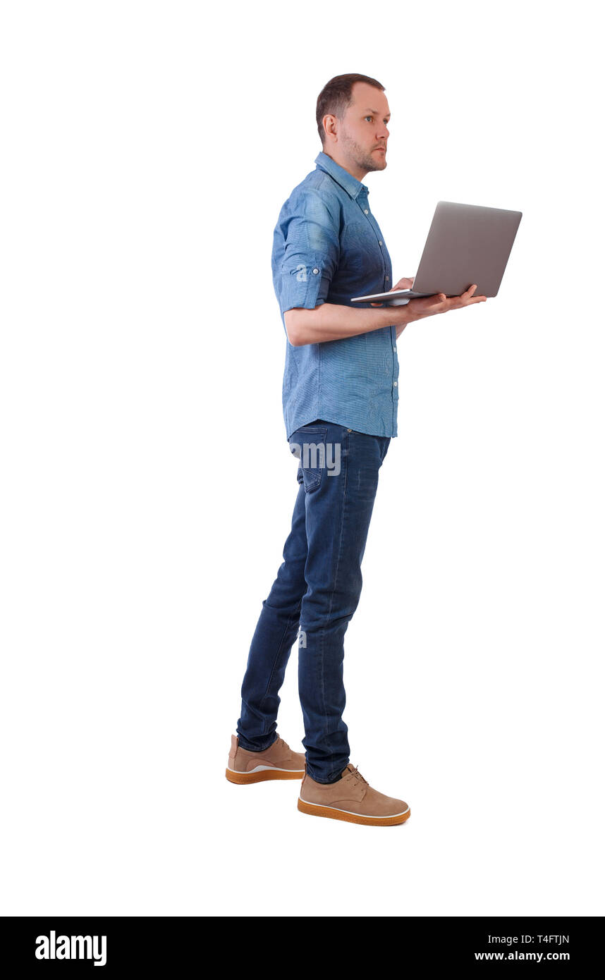 Back view of a man who is standing with a laptop. Rear view people ...