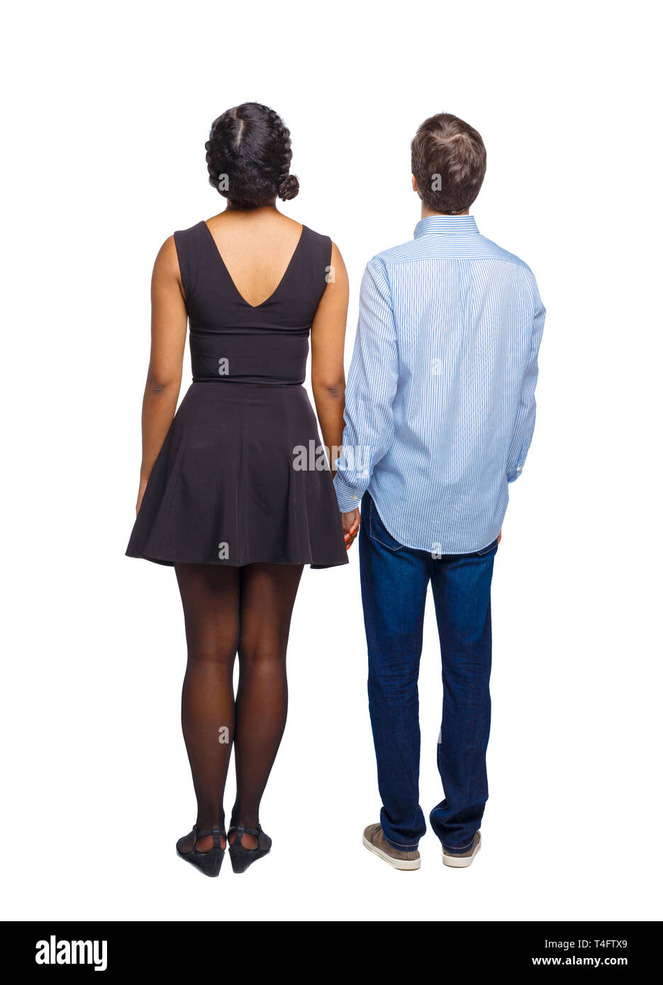 Back view of the interracial couple. friendly girl and guy together ...