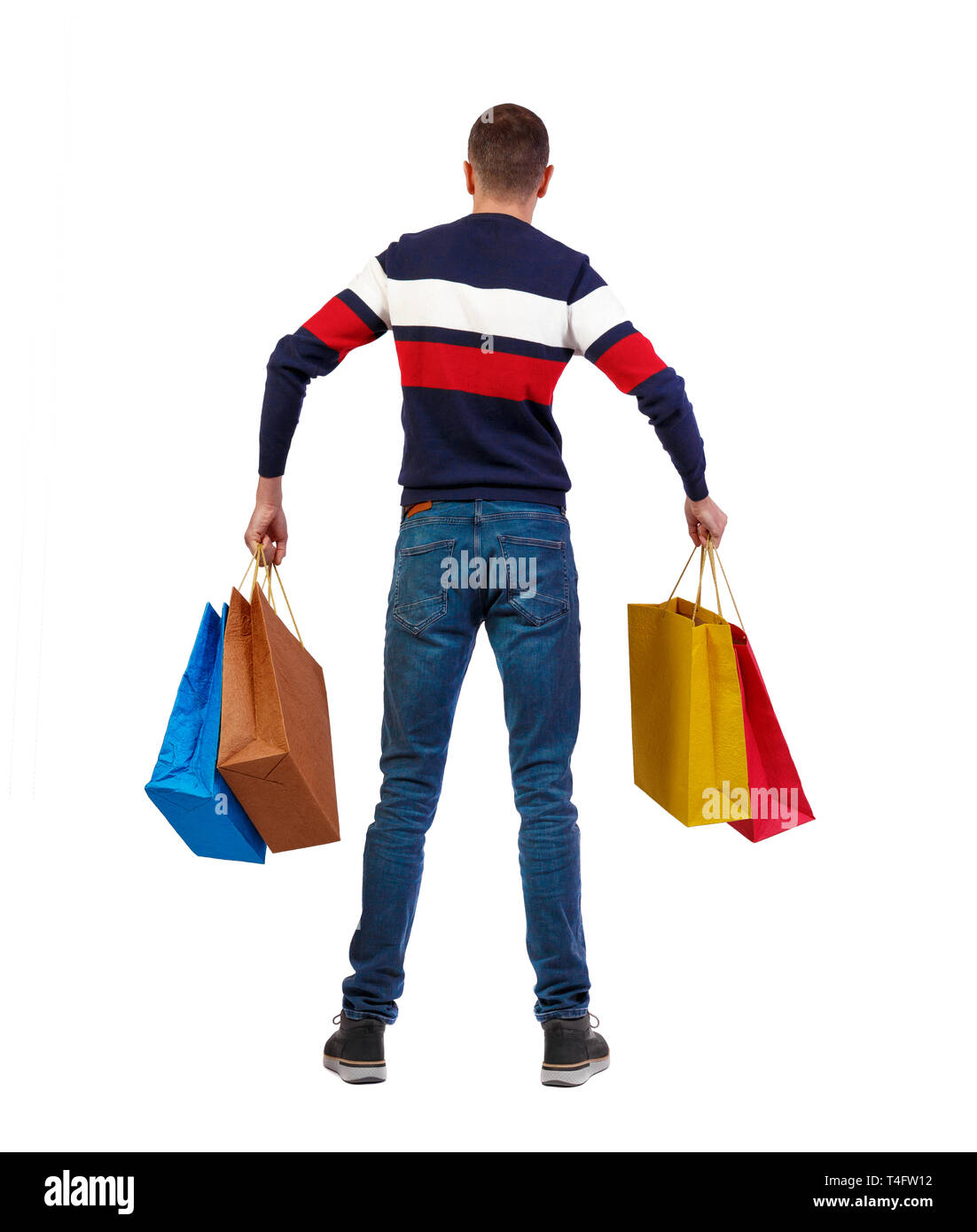 back view of man with shopping bags . beautiful brunette guy in motion ...