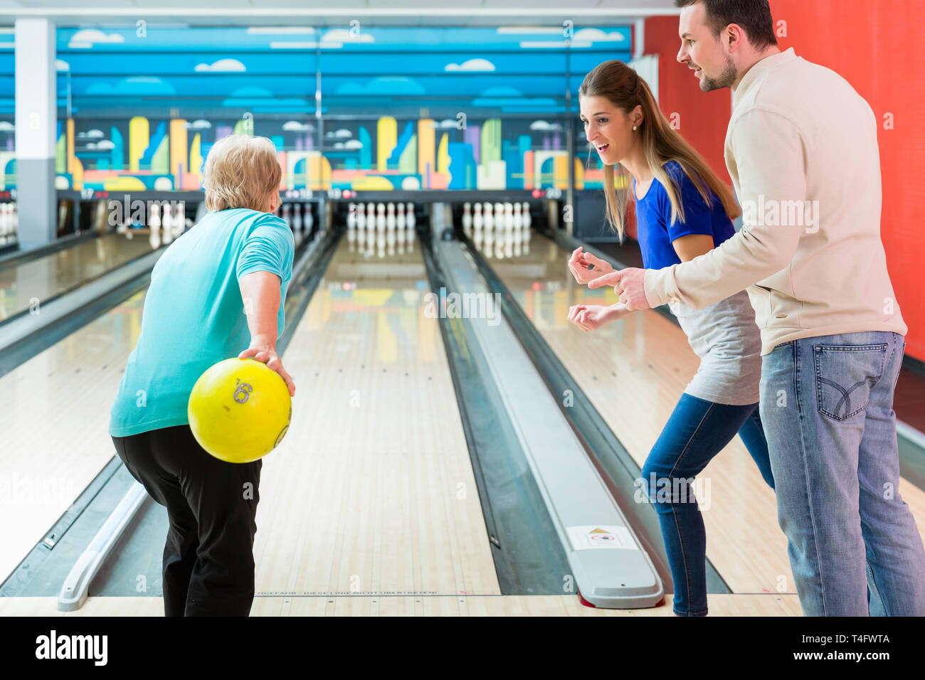 Mature woman bowling Stock Photo - Alamy