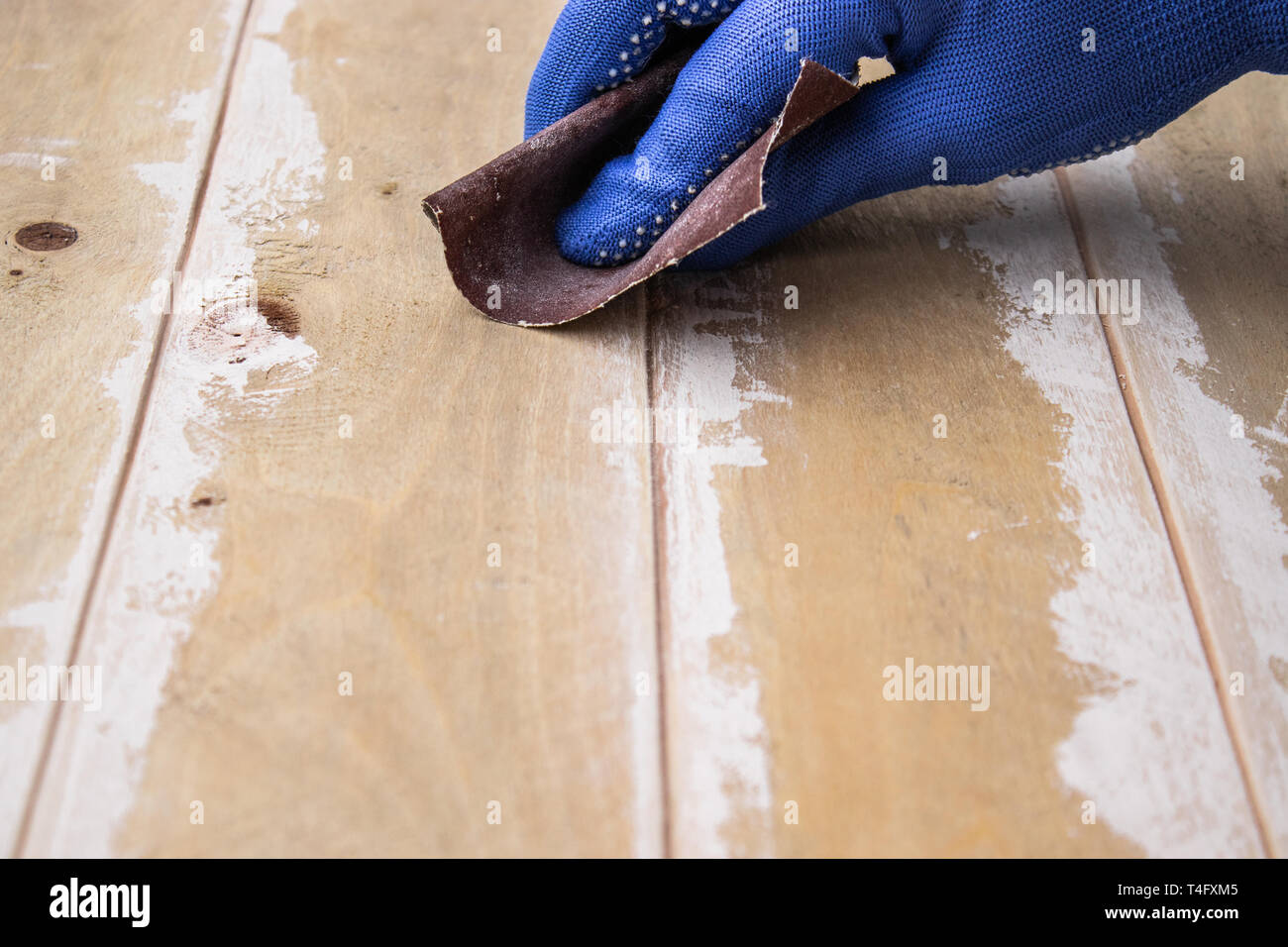 emery paper rubs the board. Grinding boards before painting ...