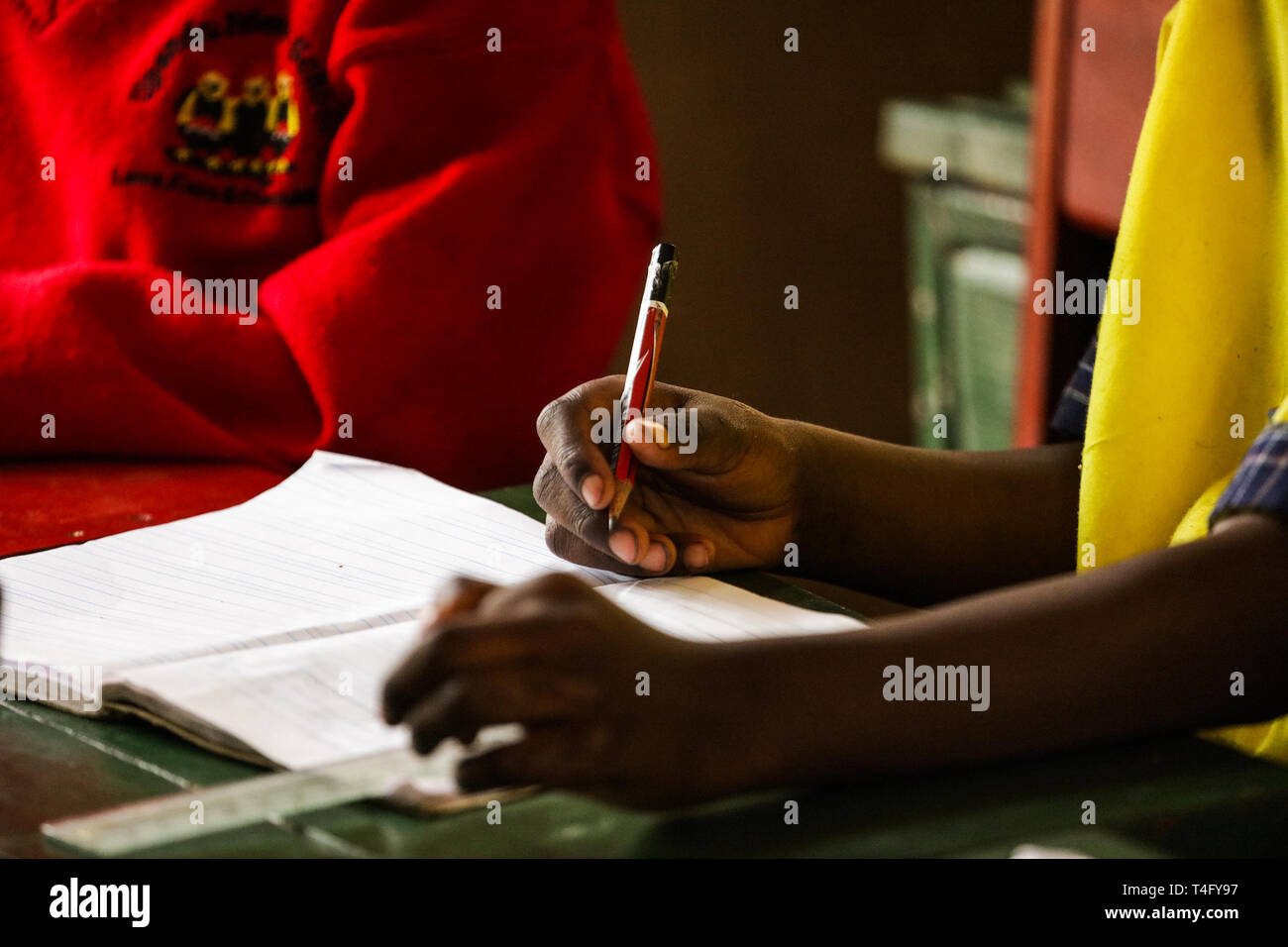 Close-up picture of child hands holding a pencil and writing down new ...