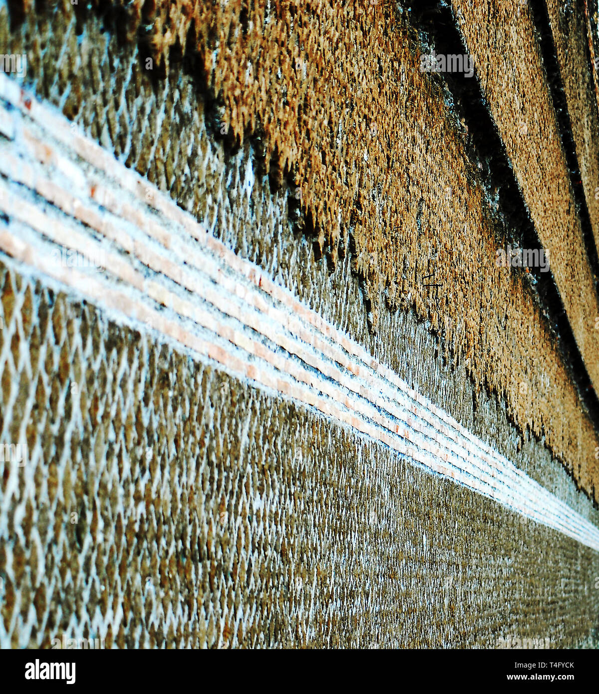 The textures and contrasting lines in this close up of a wall in ...