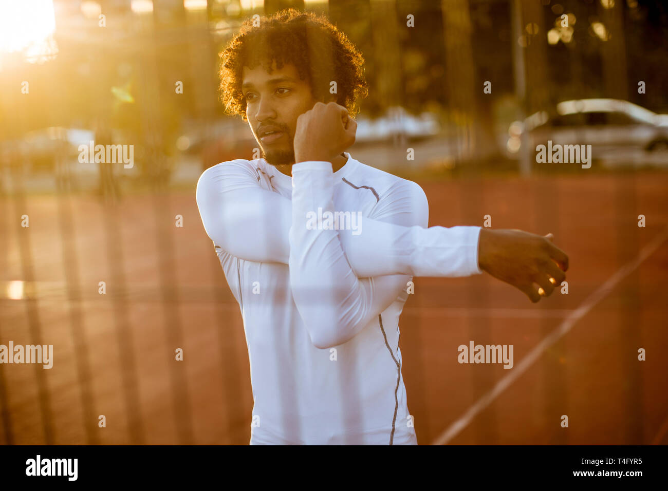 Young african american man stretching outdoor hi-res stock photography and images - Alamy