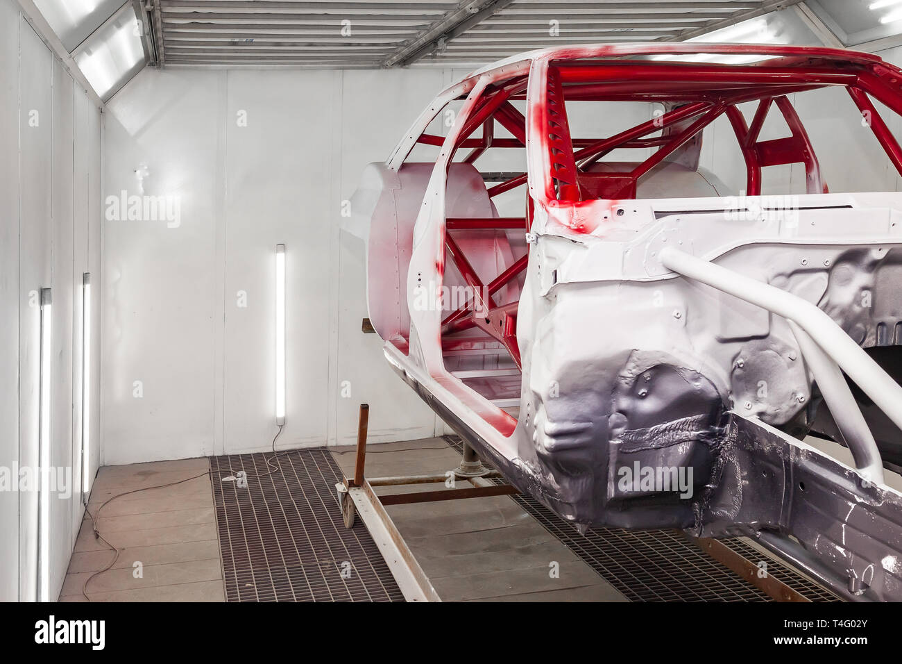 Painting in red and black color of the inside of the frame of the car ...