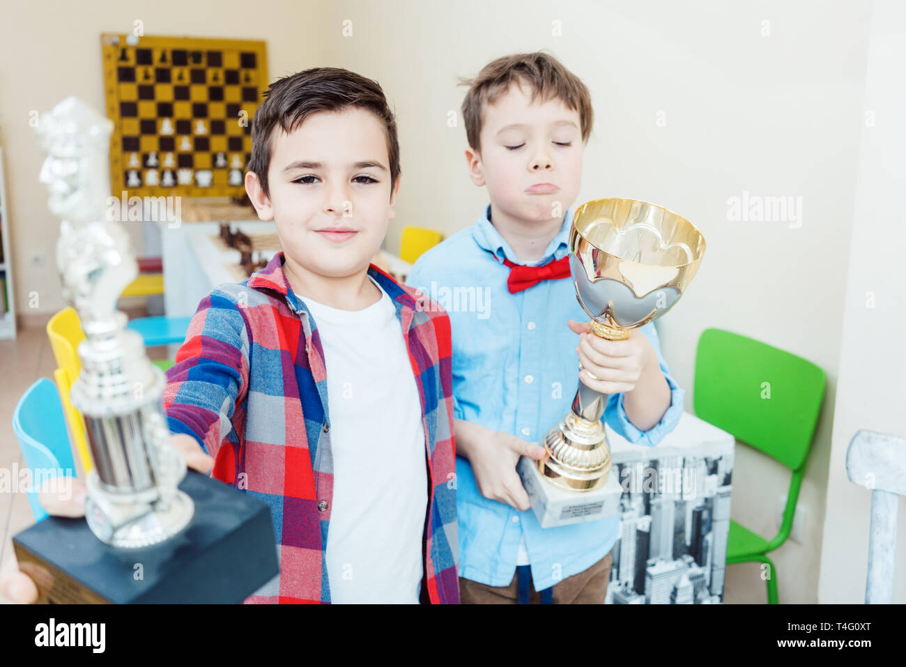 Child winner trophy hi-res stock photography and images - Alamy