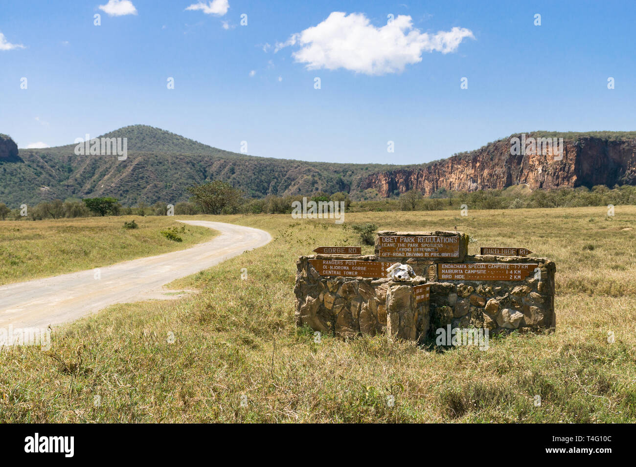 Stone road sign with directions, Hells Gate National Park, Kenya Stock ...
