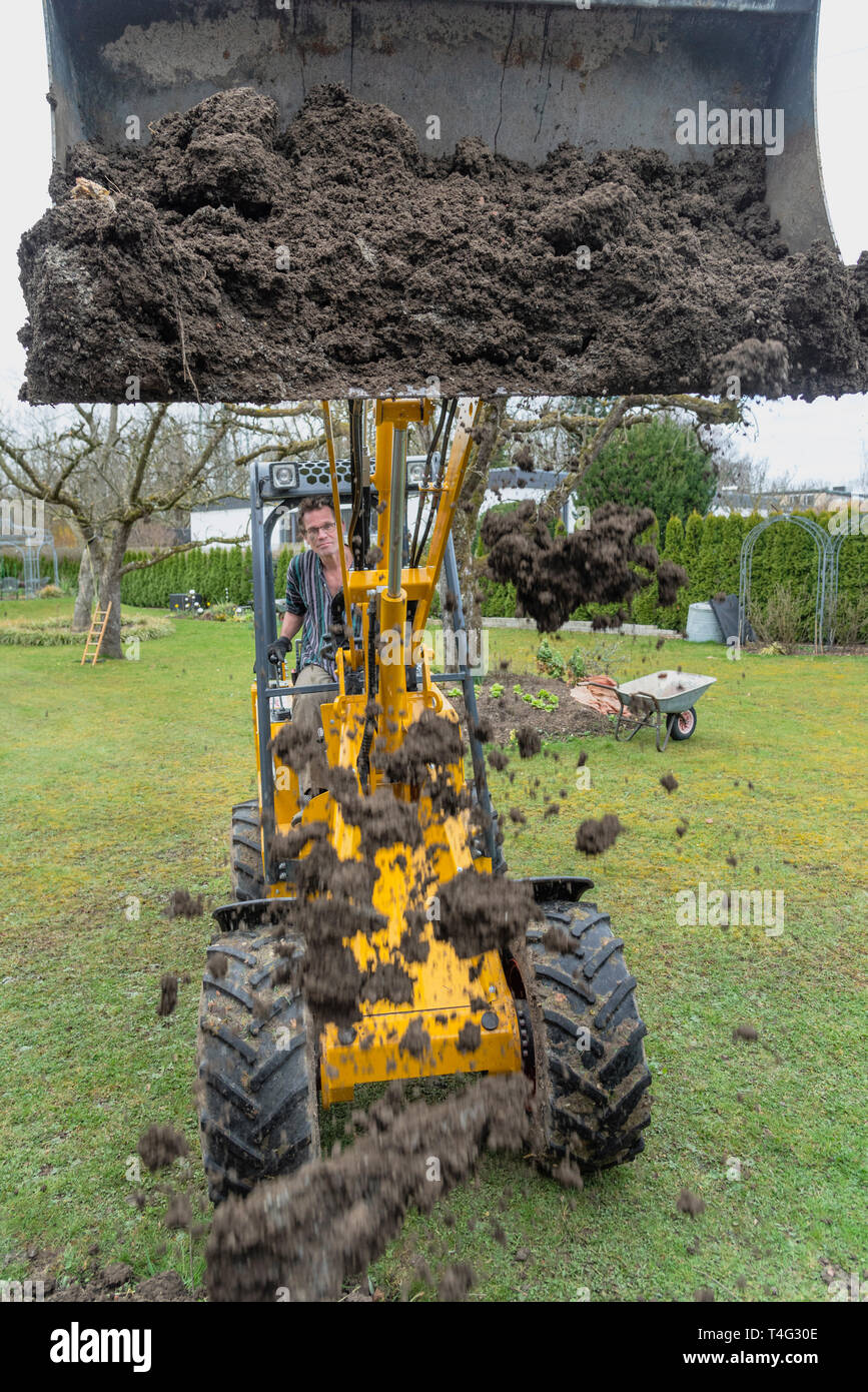 Rough earthworks using a wheel loader Stock Photo - Alamy