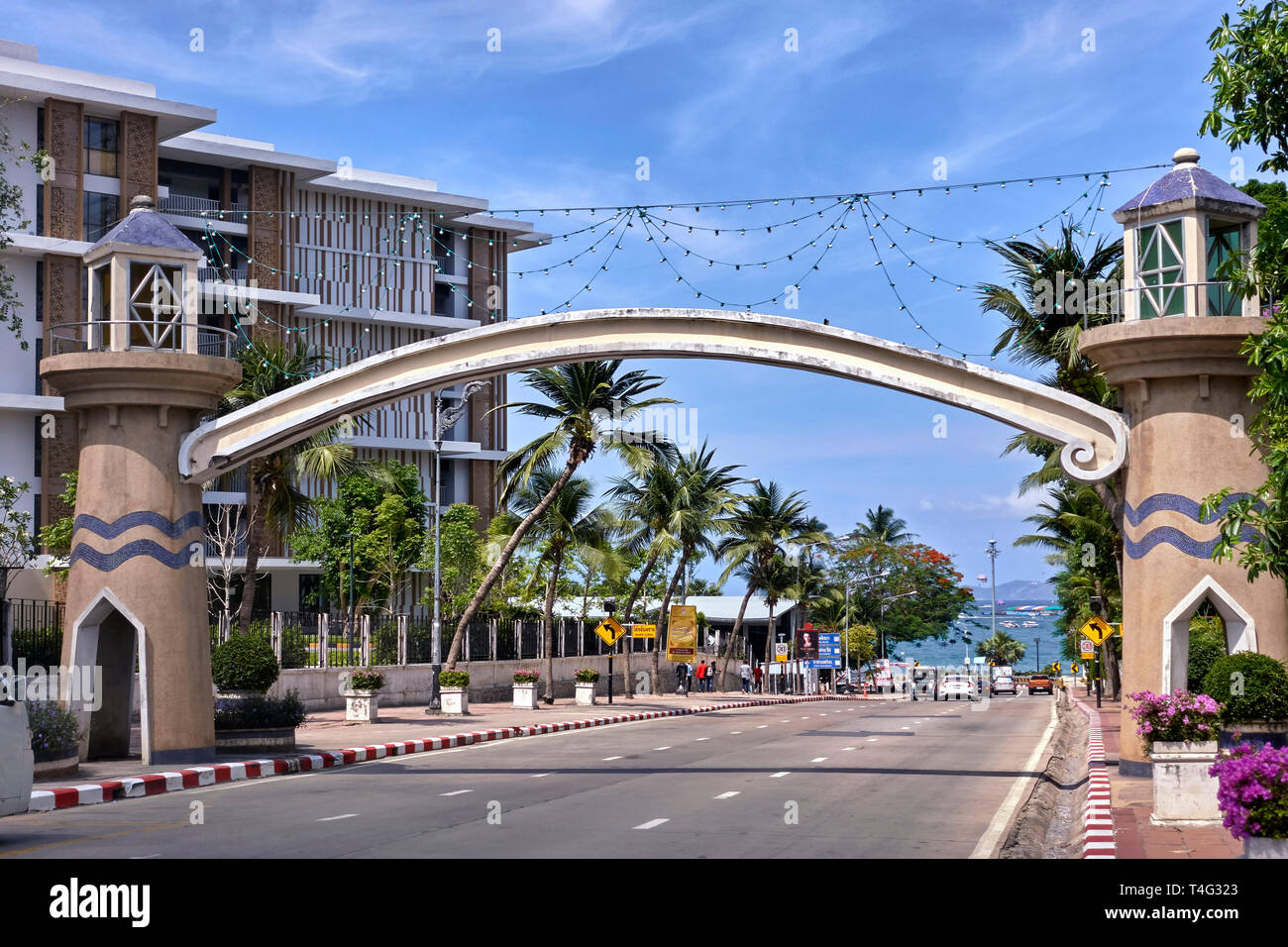 Approach road with arch entrance to Pattaya city and beach, Thailand ...