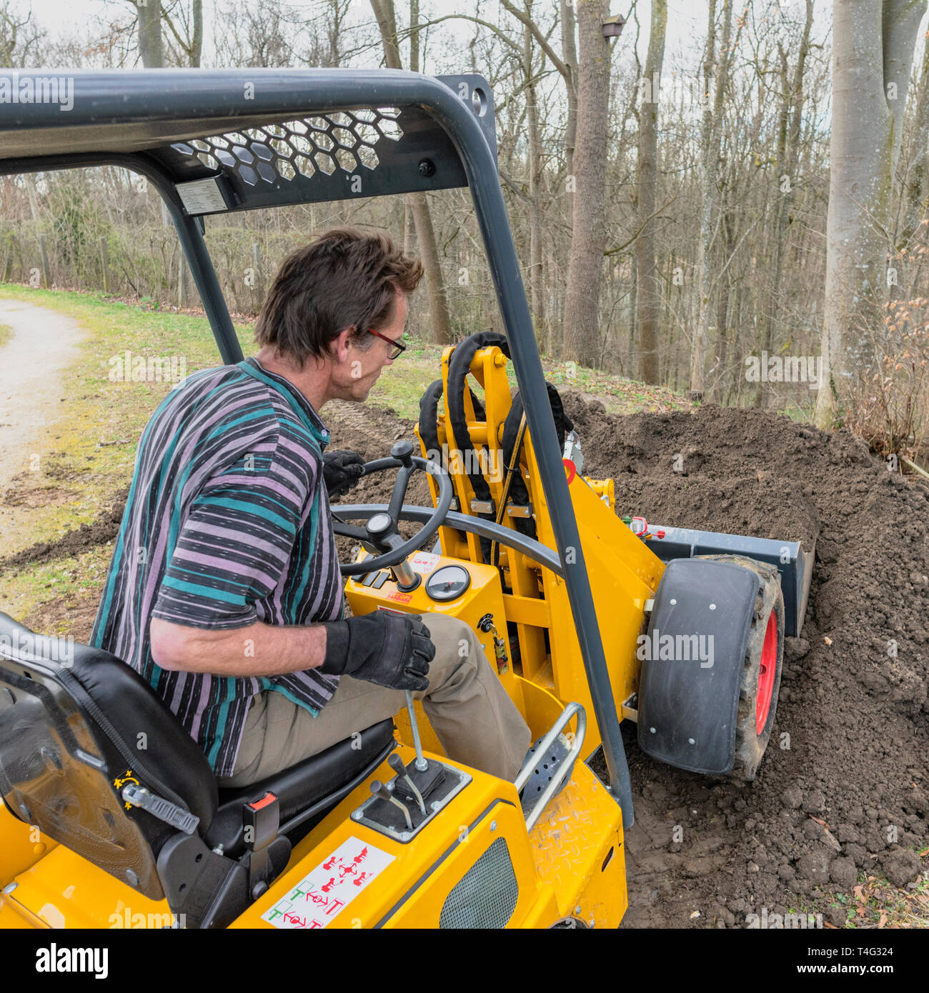 Rough earthworks using a wheel loader Stock Photo - Alamy