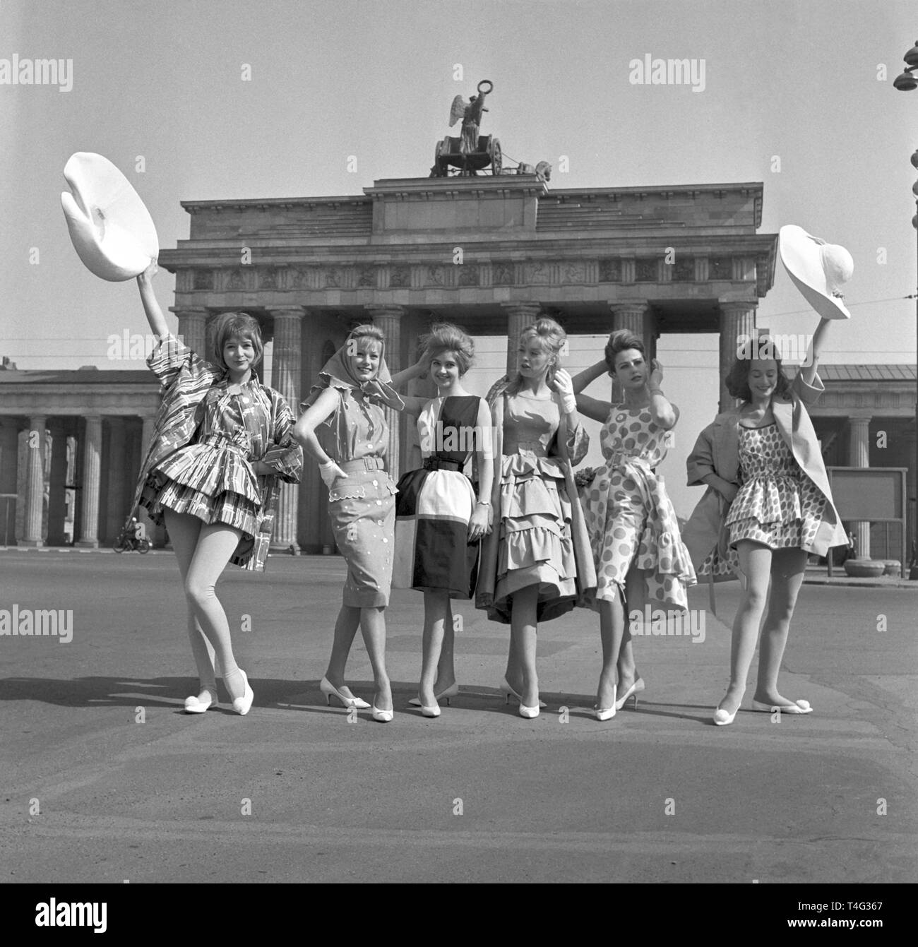 On 02 April 1960, models present the collection with material dyed with ...