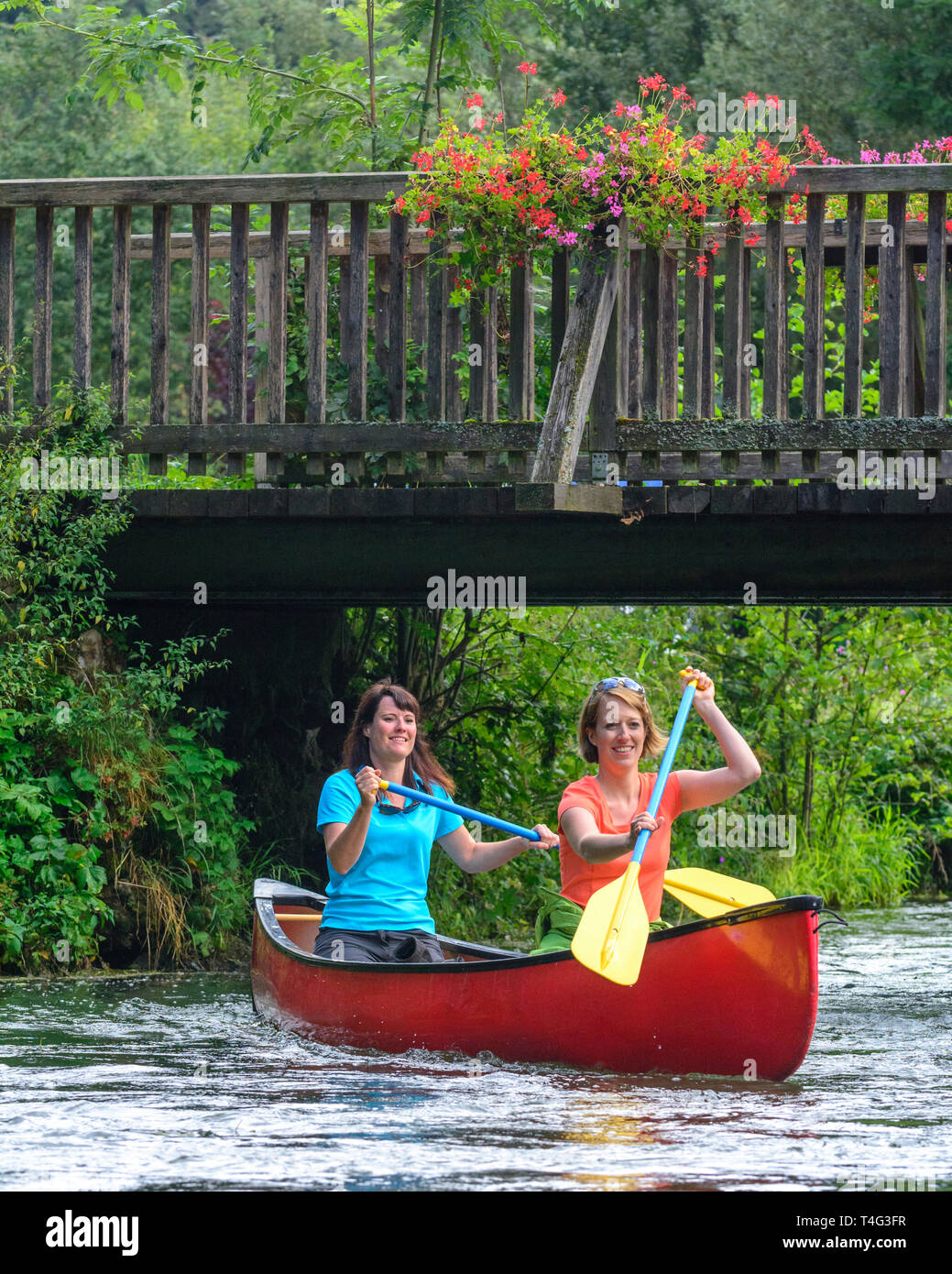 Two women navigating canoe on river in bavaria Stock Photo - Alamy