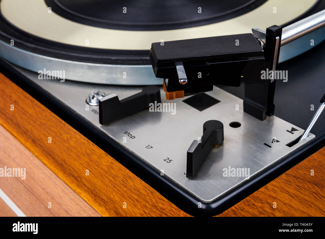 Close up of vintage turntable vinyl record player. Wooden plinth. Retro ...