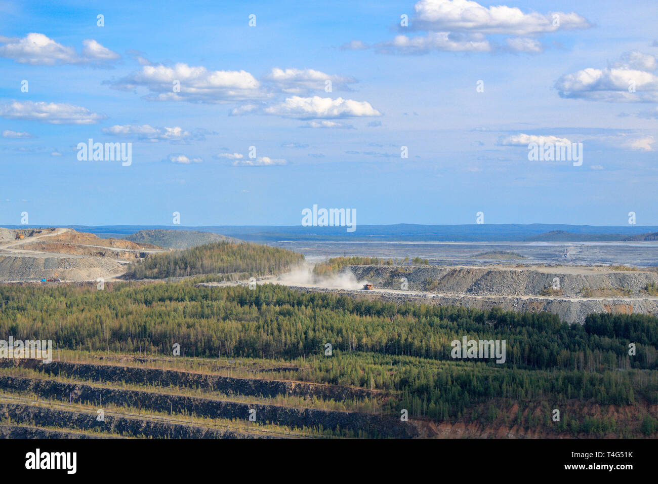 Aerial view industrial of opencast mining quarry with lots of machinery ...