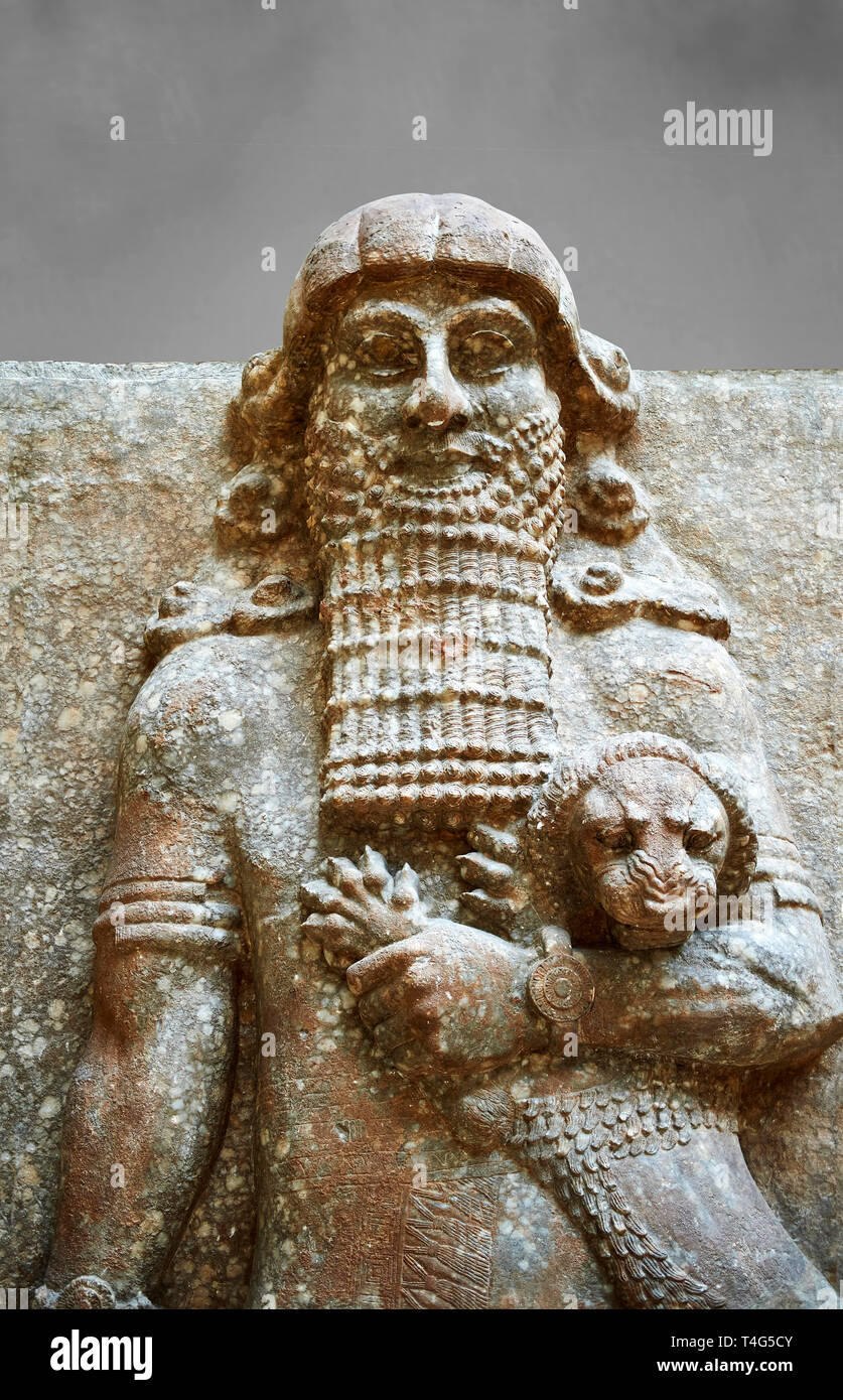 Stone statue of a Hero holding a lion. From facade M of the palace ...