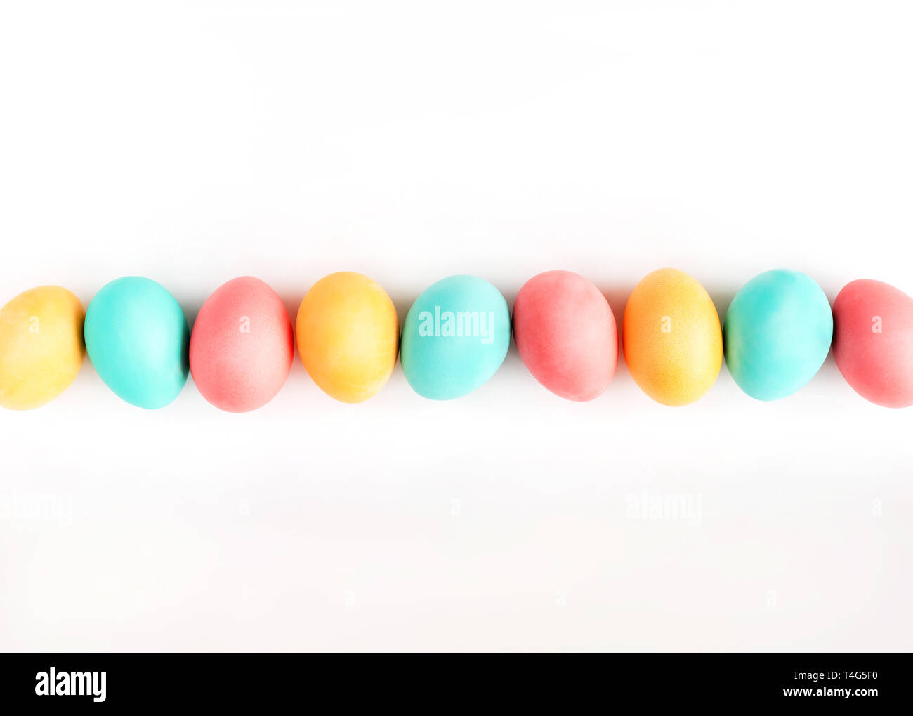 Colorful handmade Easter eggs lined on white background. Flat lay Stock ...