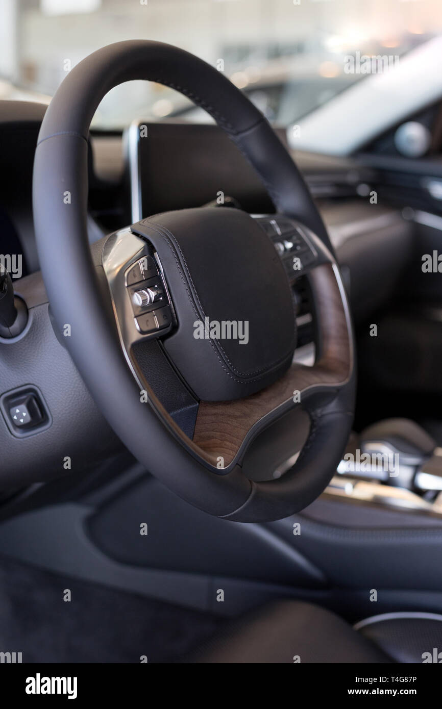 Interior of prestigious new car at dealer showroom. Modern ...