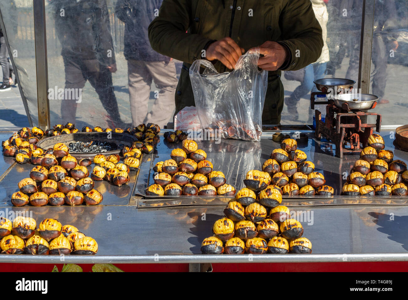 Turkish street food, roasting chestnut grill Stock Photo - Alamy
