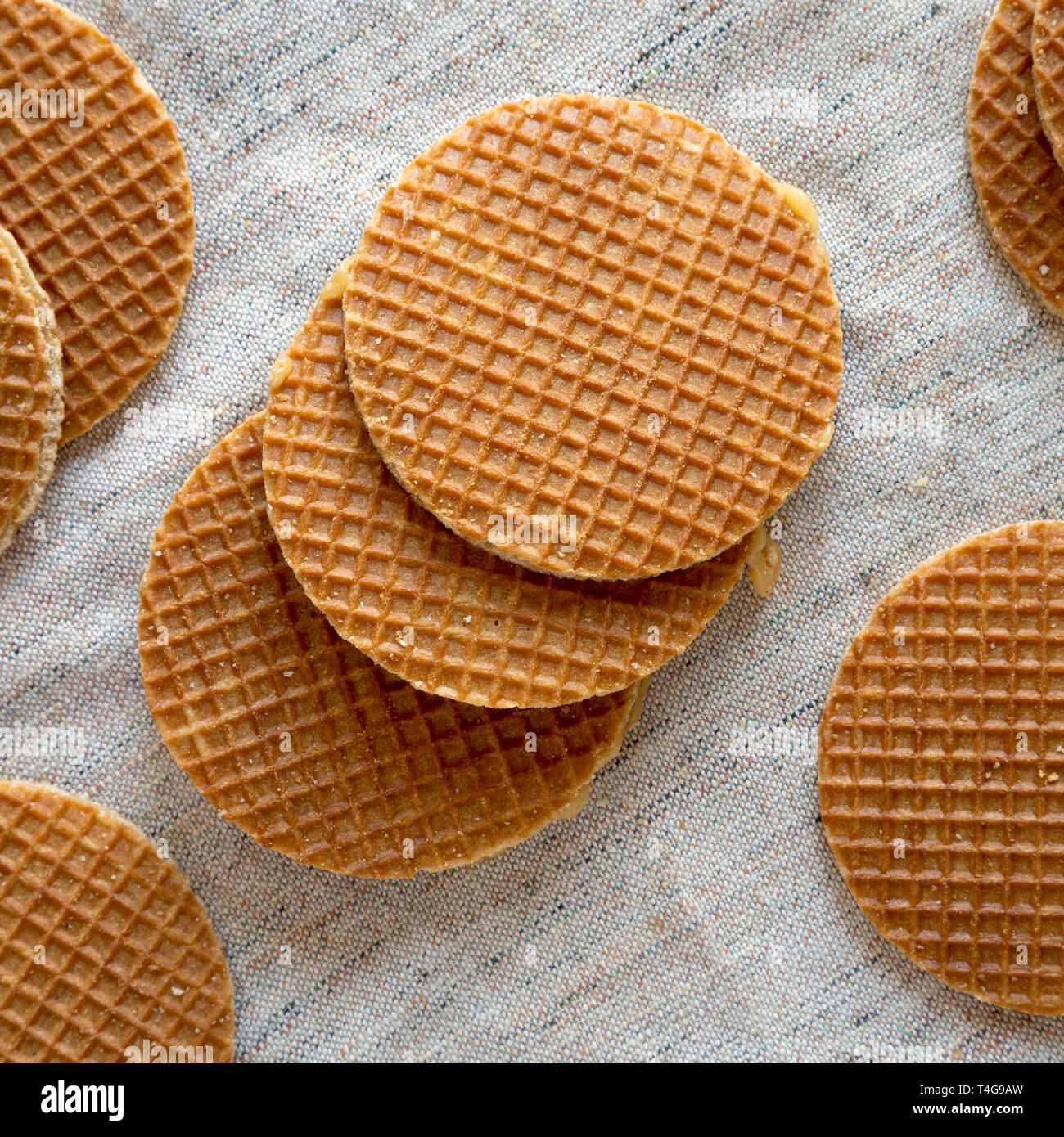 Sweet homemade Dutch stroopwafels with honey-caramel filling on cloth ...