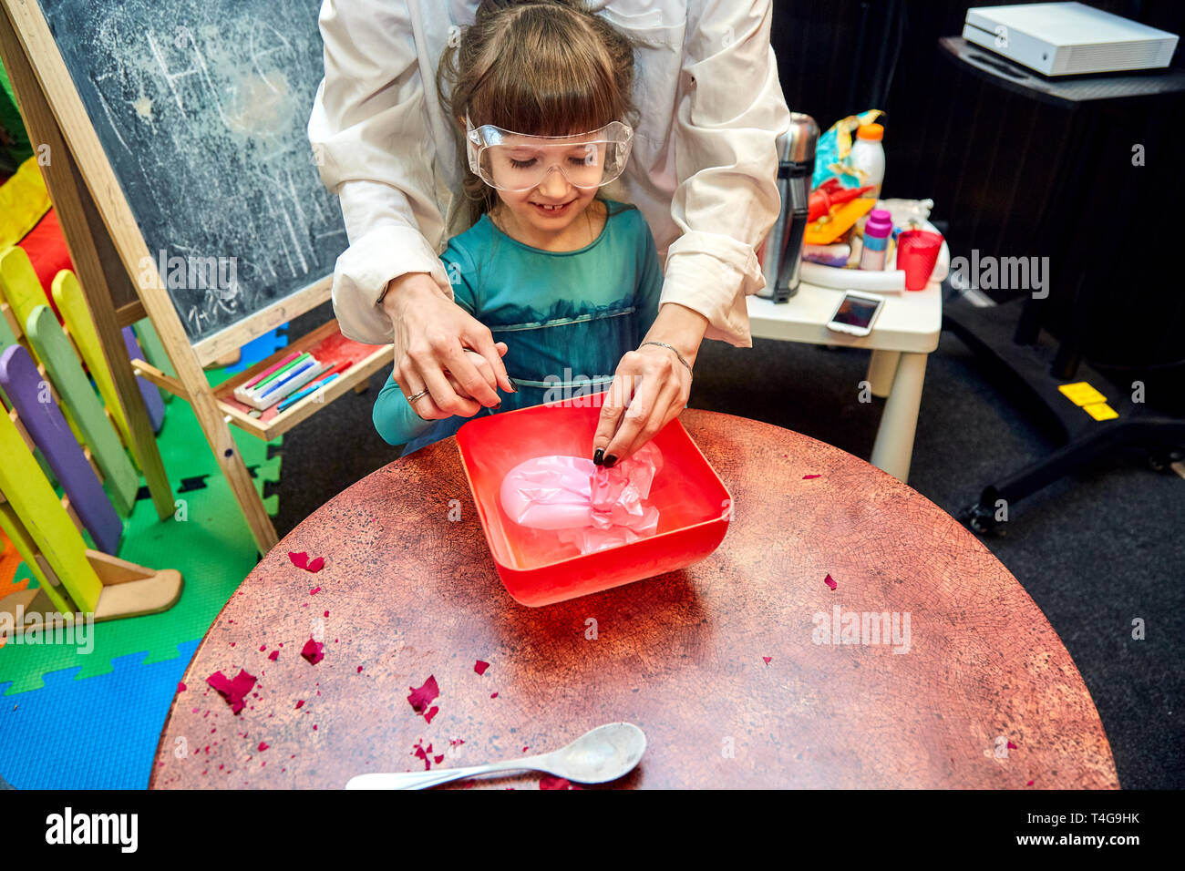 Chemical show for kids. Professor carried out chemical experiments with ...