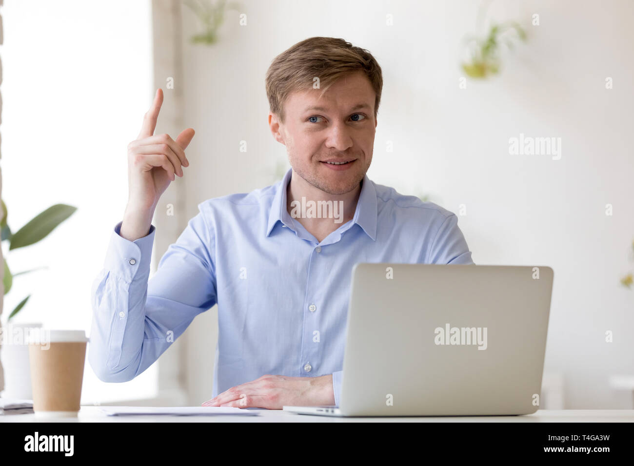 Businessman with pointed up finger. Idea concept Stock Photo - Alamy