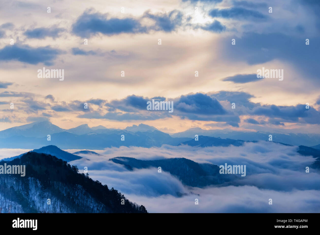 Beautiful distant winter mountains and skyscape with mist Stock Photo ...