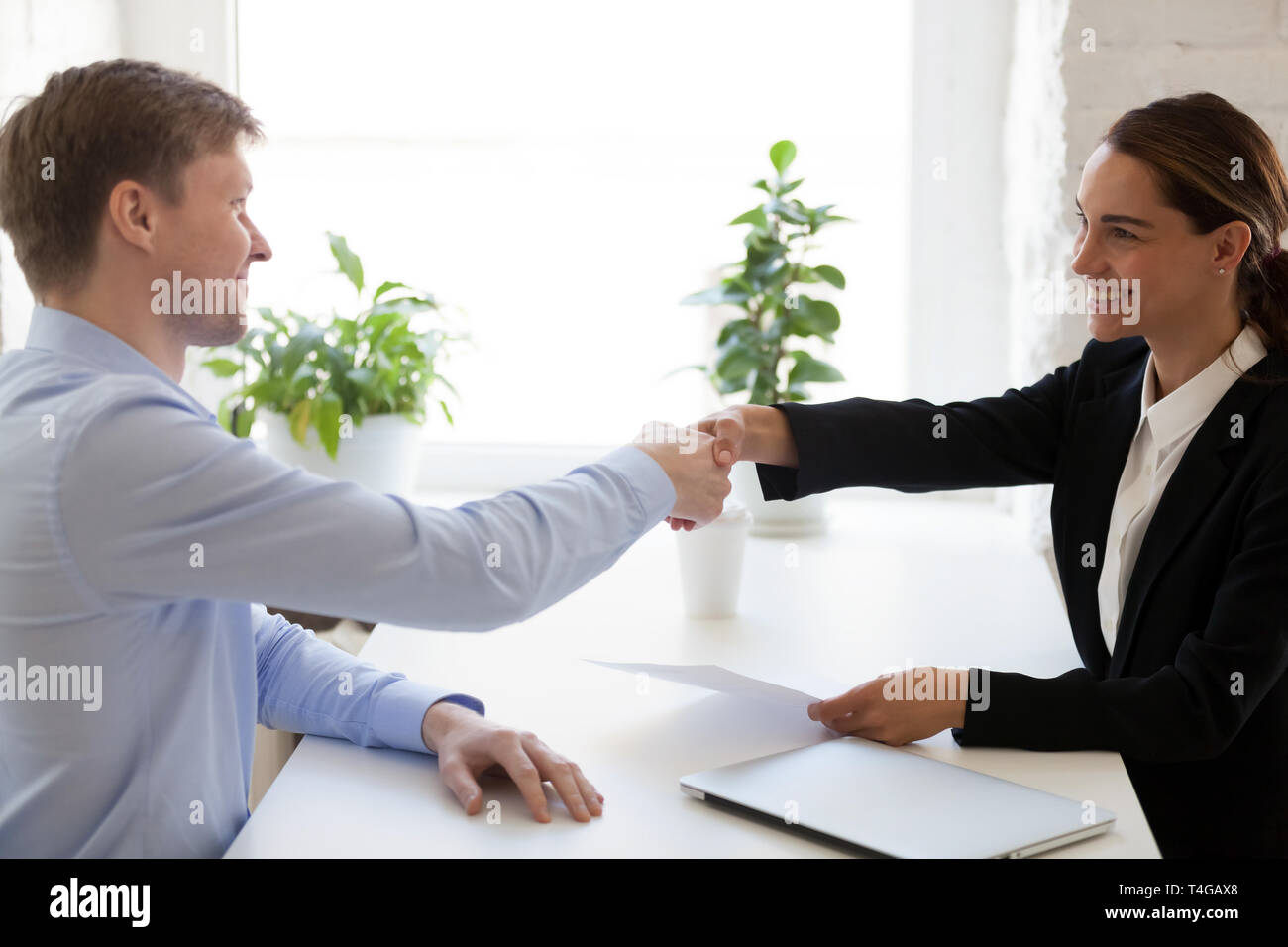 Successful job interview with boss and employee handshaking Stock Photo ...