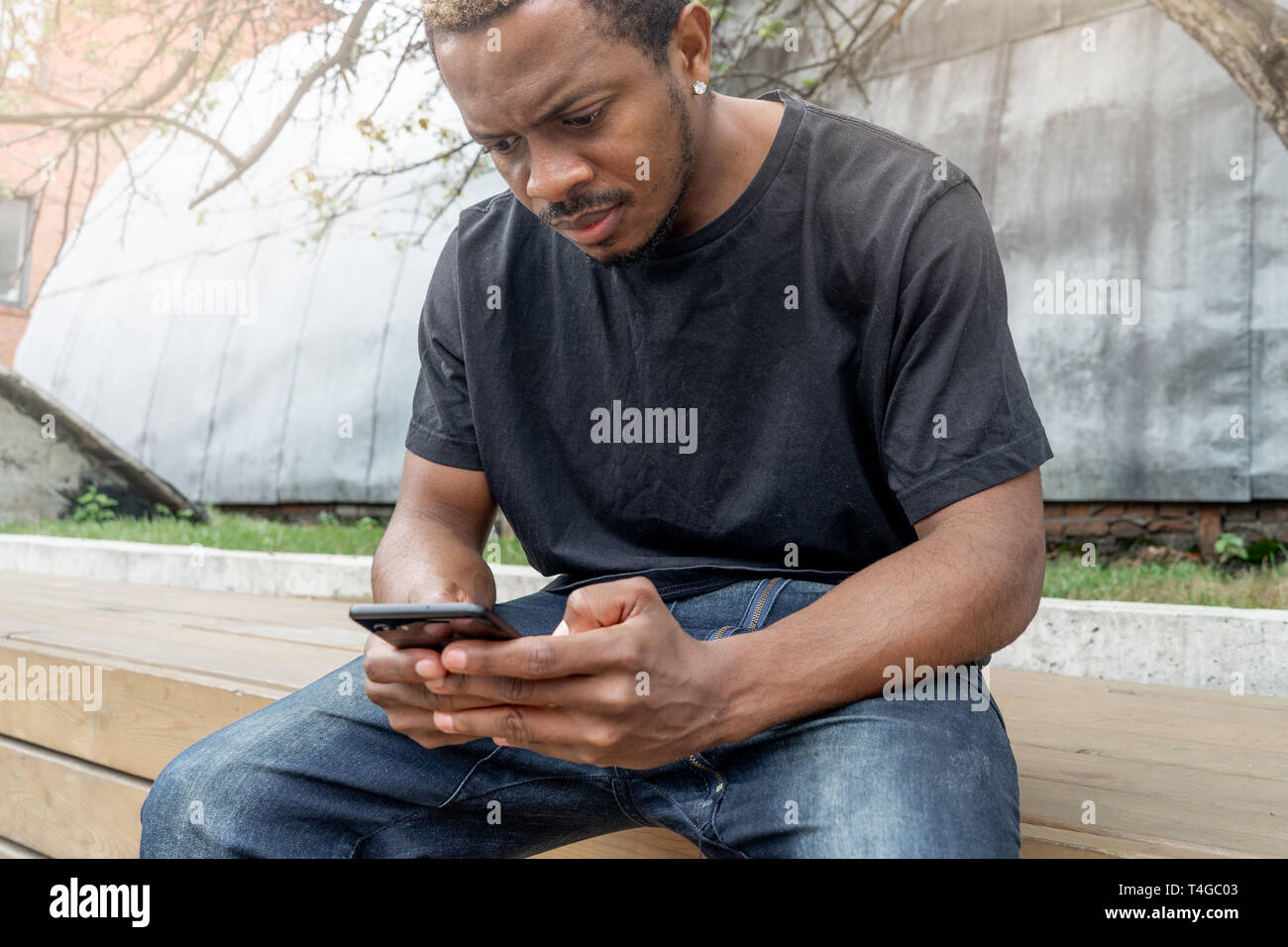 Man sitting under tree face hi-res stock photography and images - Alamy