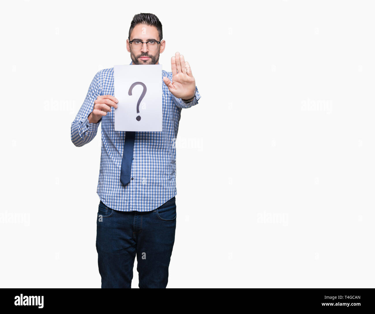 Handsome young business man holding paper with question mark over ...