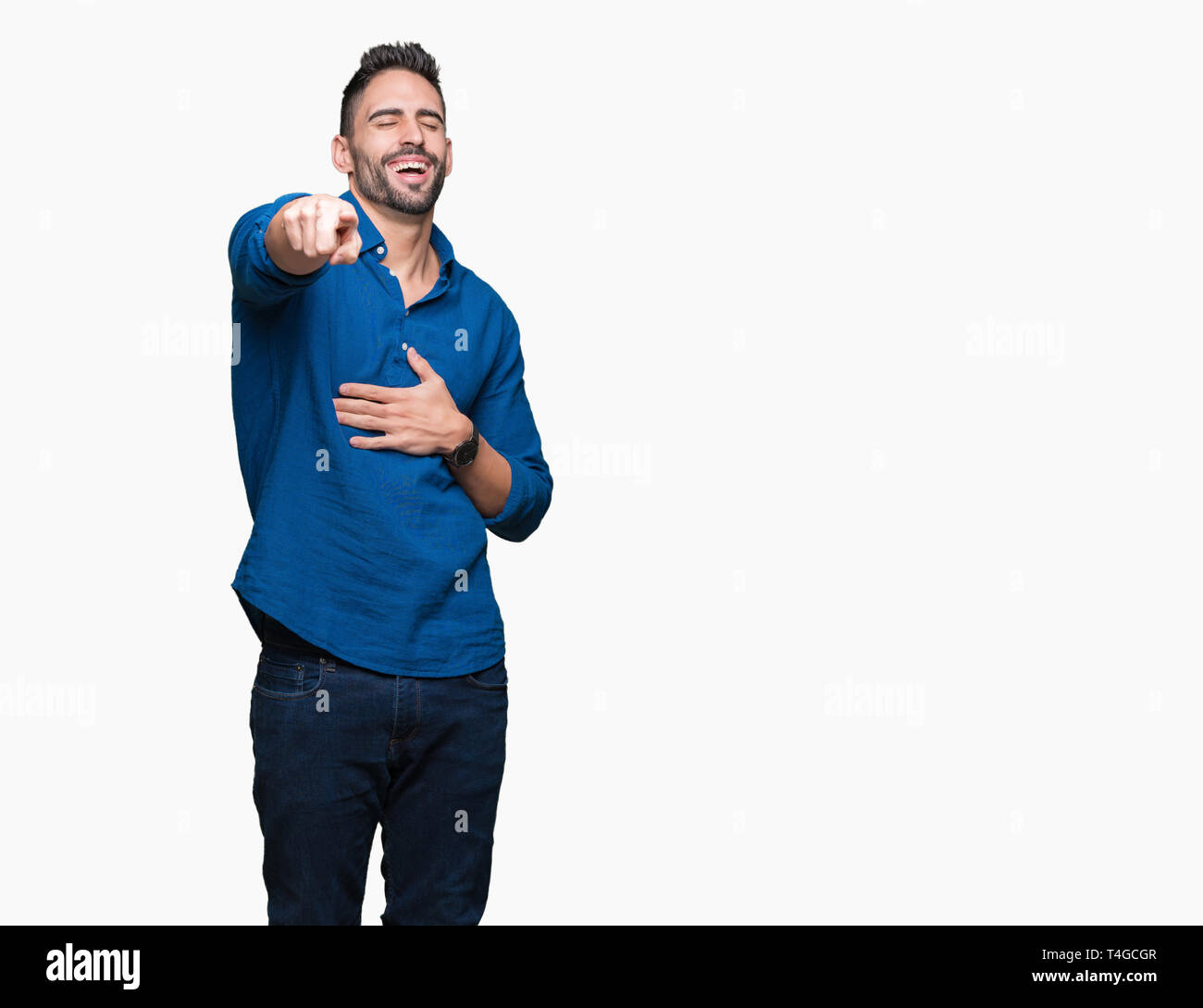 Young handsome man over isolated background Laughing of you, pointing ...