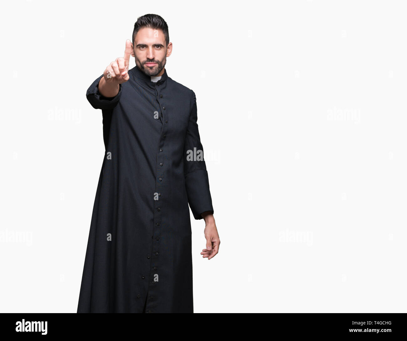 Young Christian priest over isolated background Pointing with finger up ...