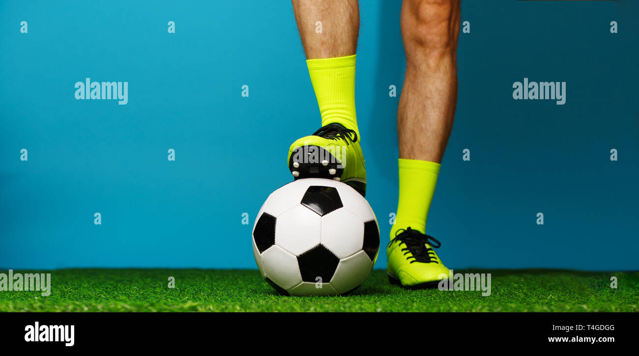 Soccer player with ball on the green grass Stock Photo - Alamy