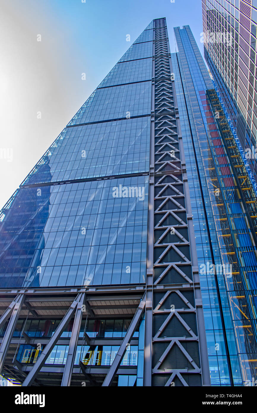 A modern London glass facade finance building streched upward with a ...