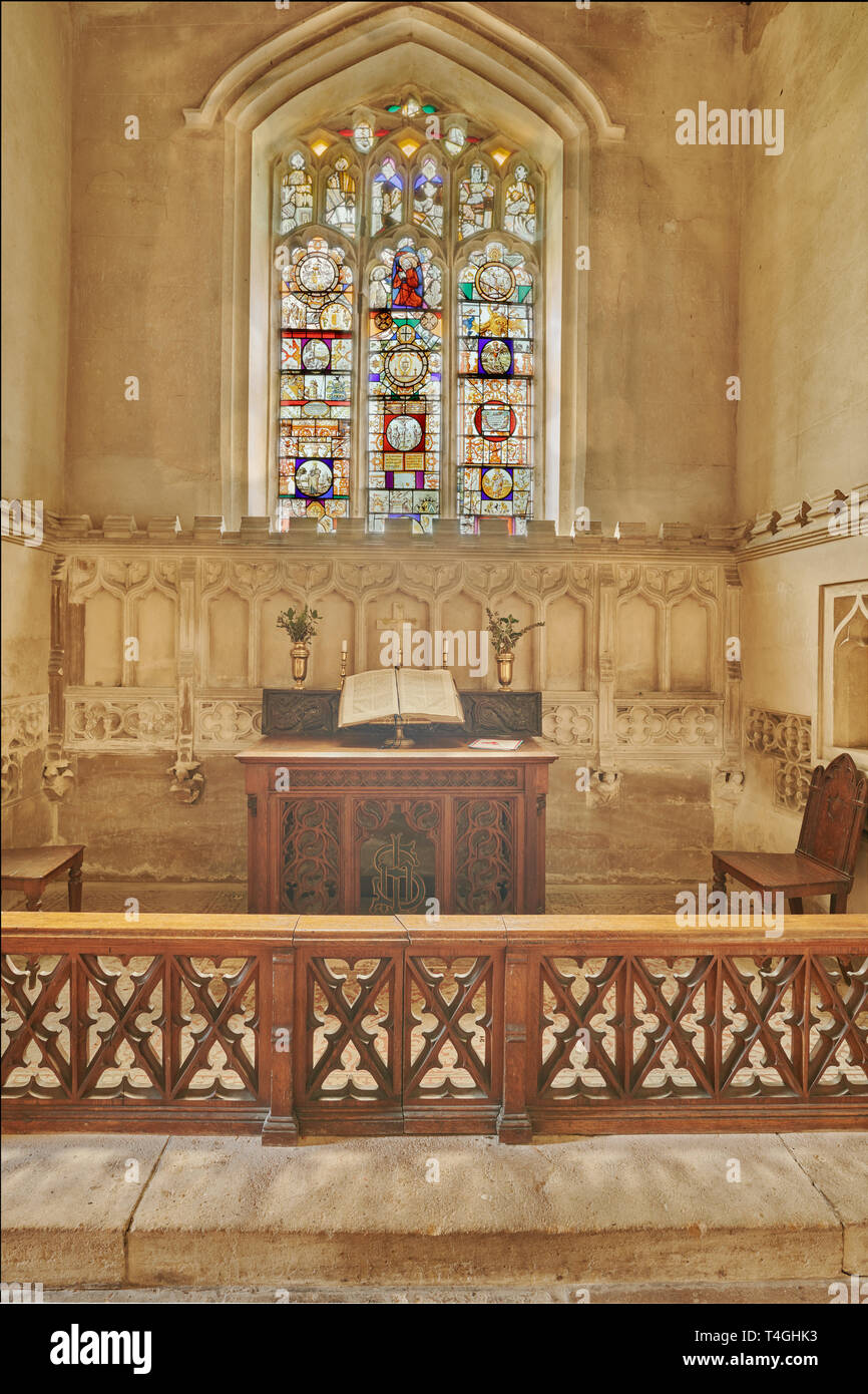 Altar, Bible and stained glass window in a grade II listed building ...