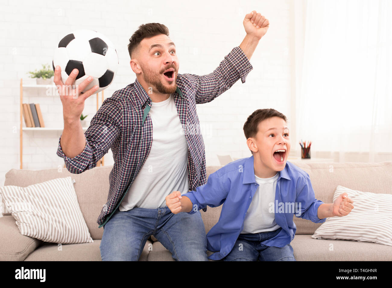 Father child football fans hi-res stock photography and images - Alamy