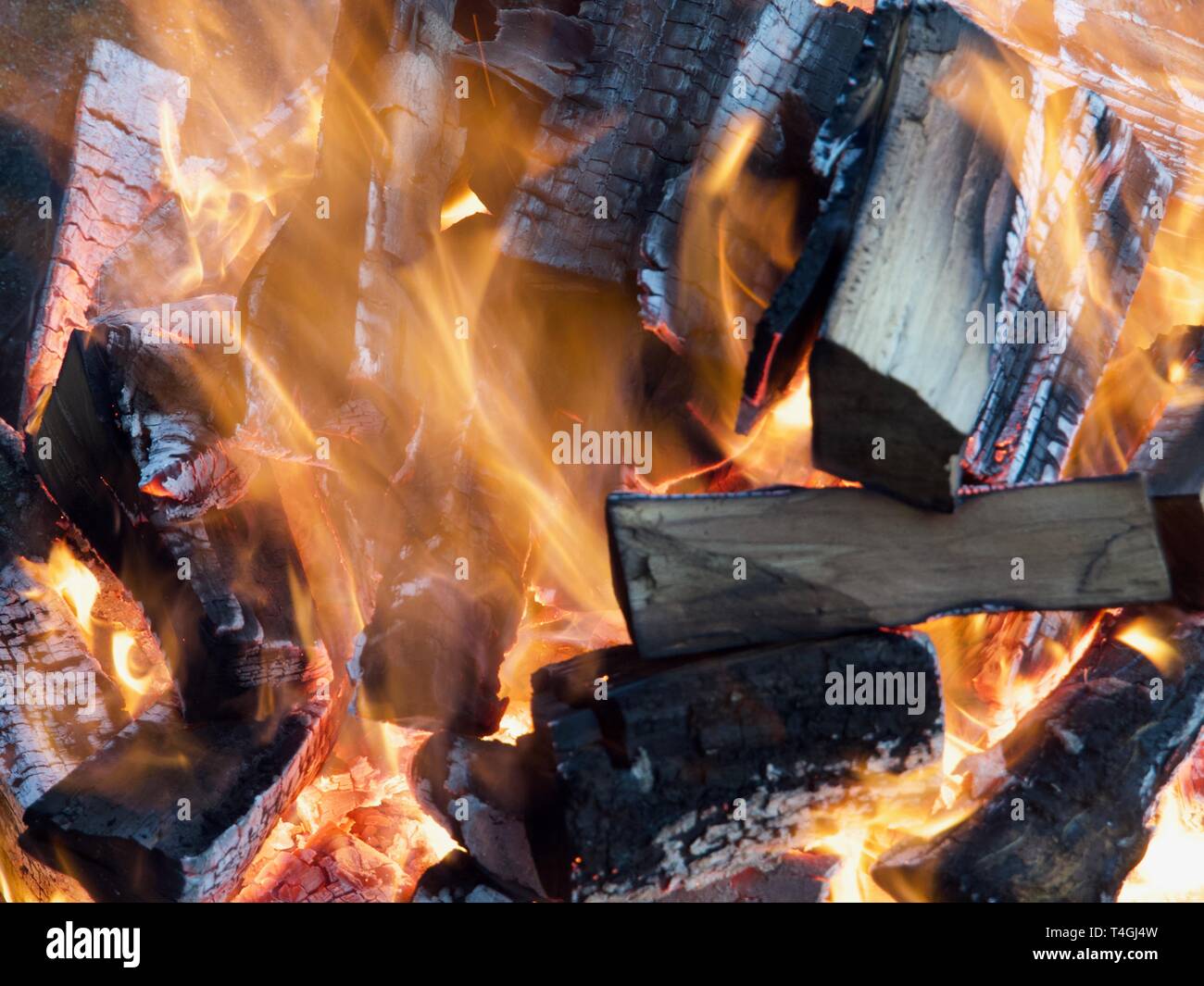 Closeup of a burning campfire with colorful flames Stock Photo - Alamy