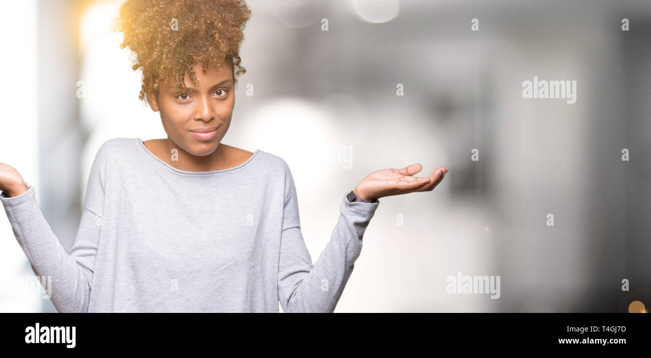 Beautiful young african american woman over isolated background ...