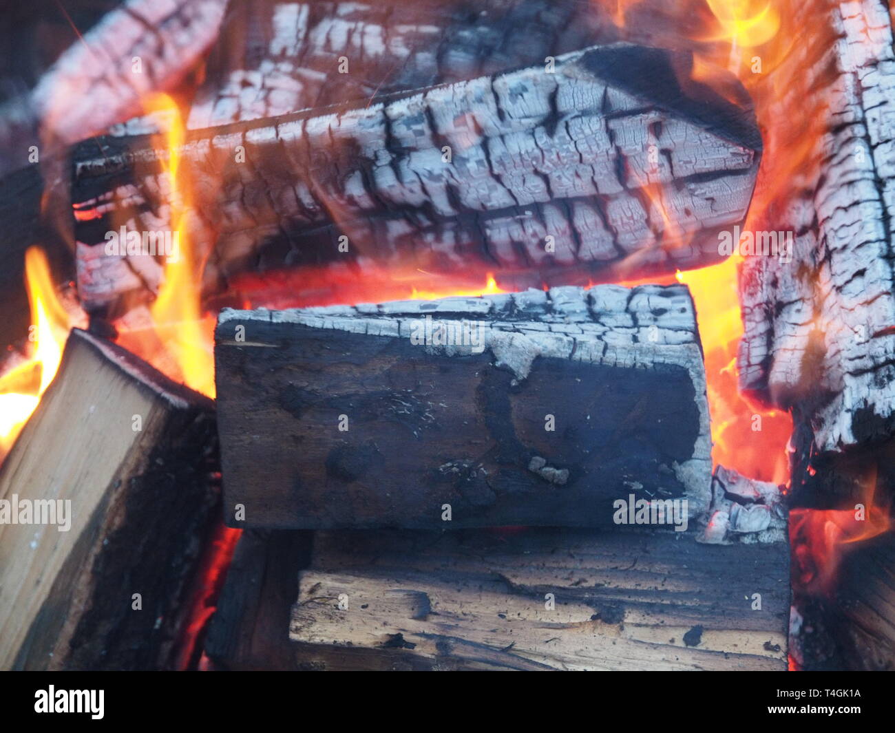 Closeup of a burning campfire with colorful flames Stock Photo - Alamy