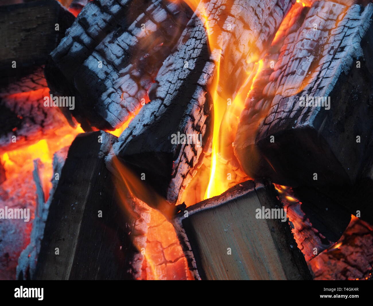 Closeup of a burning campfire with colorful flames Stock Photo - Alamy