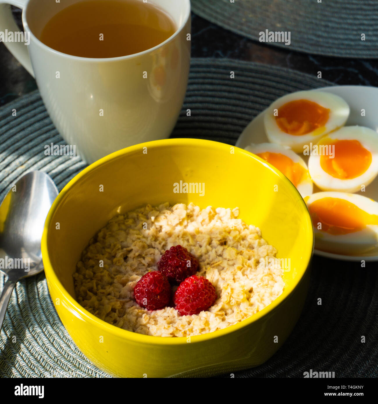 Healthy cereal oat with boiled eggs at breakfast Stock Photo - Alamy