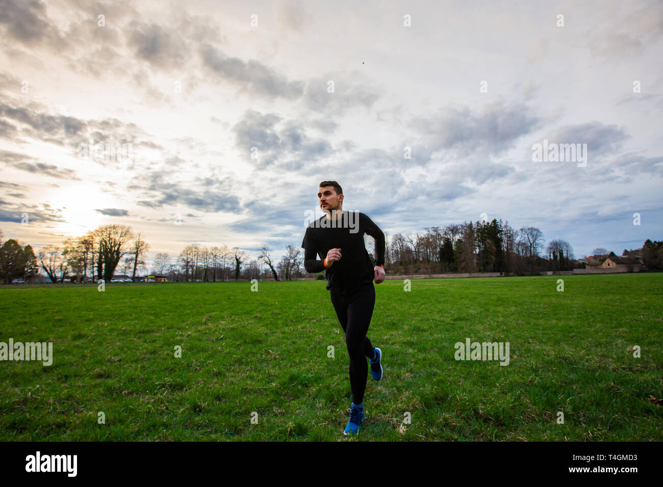 Side view of male athlete exercising people hi-res stock photography ...