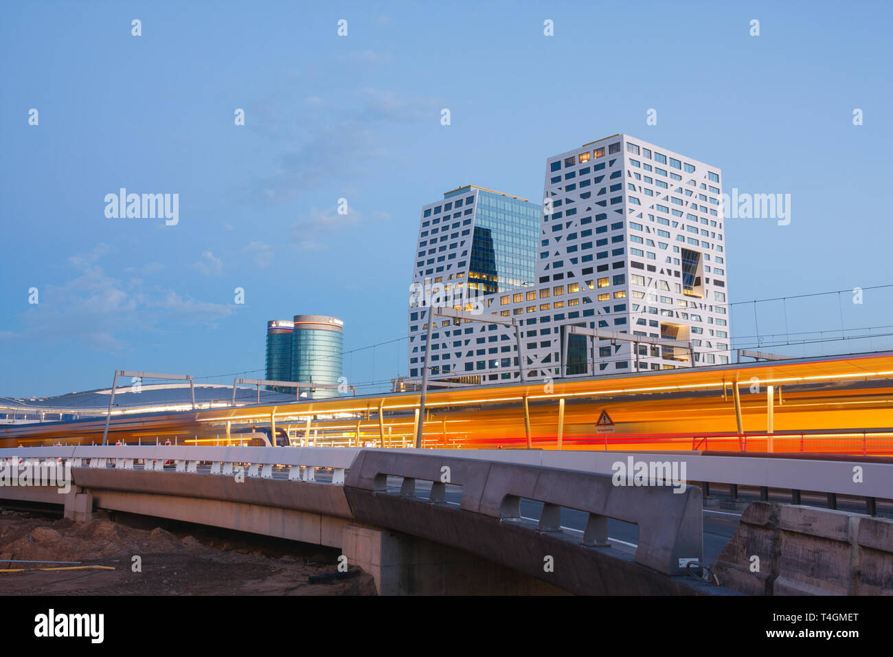 Platforms of Utrecht Centraal Station with fast moving train, the city ...