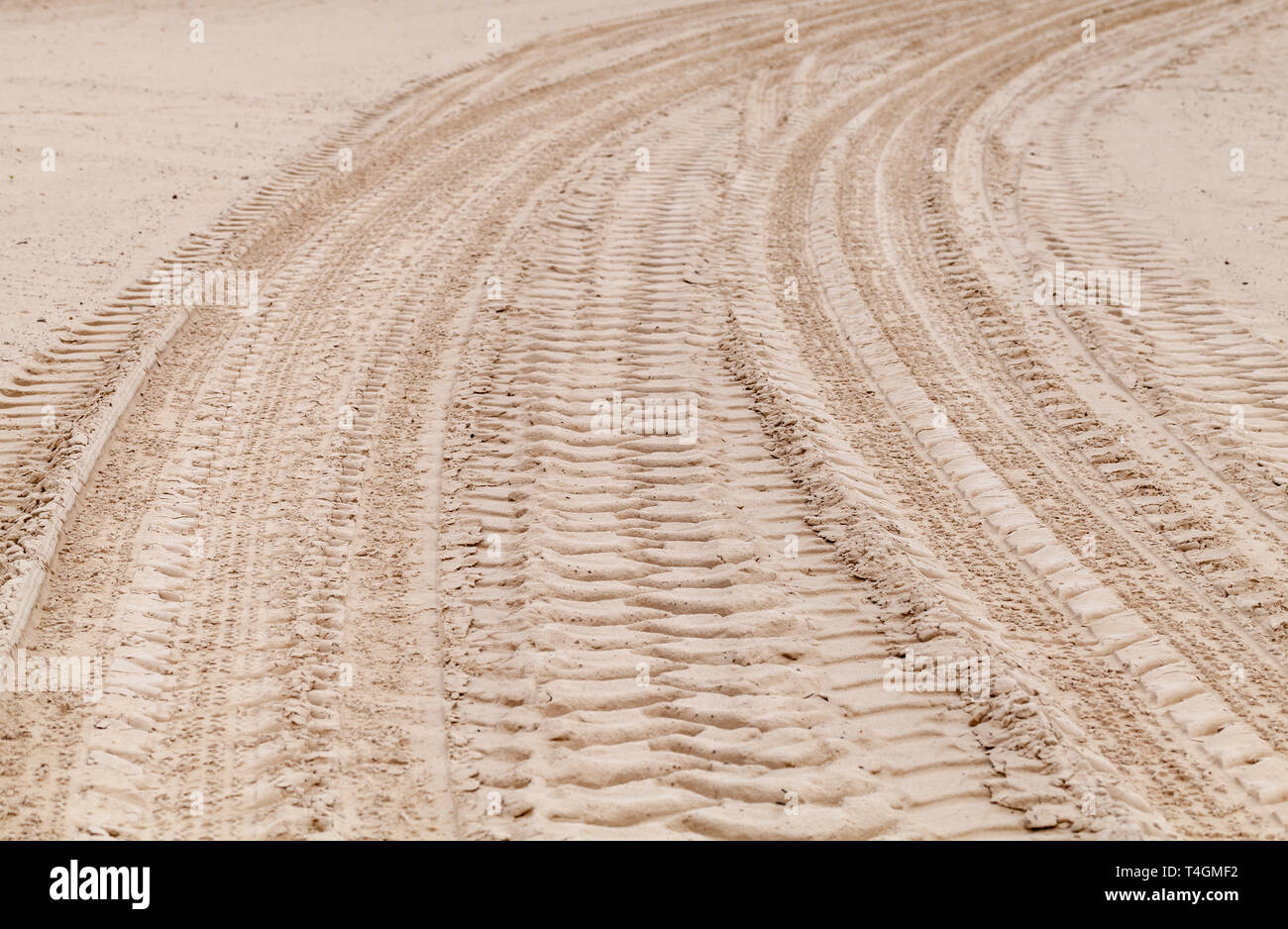 Turning tire tracks in the sand, transportation background texture ...