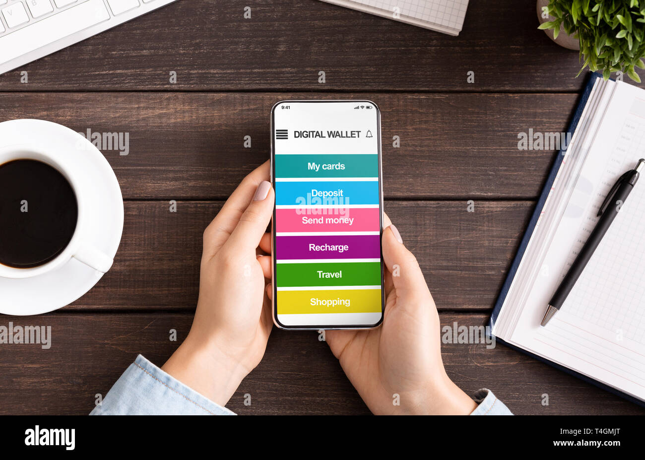 Woman holding smartphone with digital wallet application Stock Photo ...