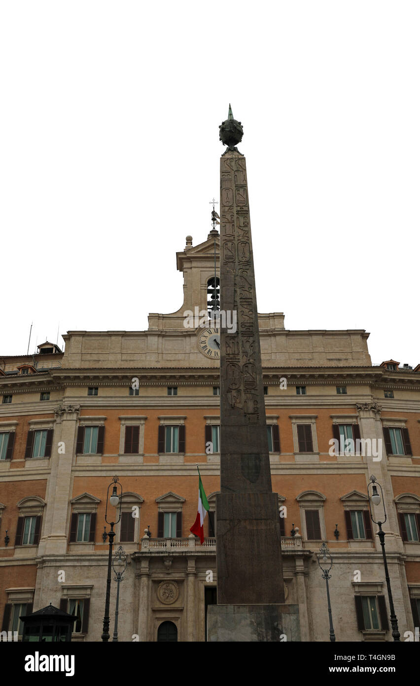big obelisk in Rome and the Montecitorio Palace and white sky Stock ...