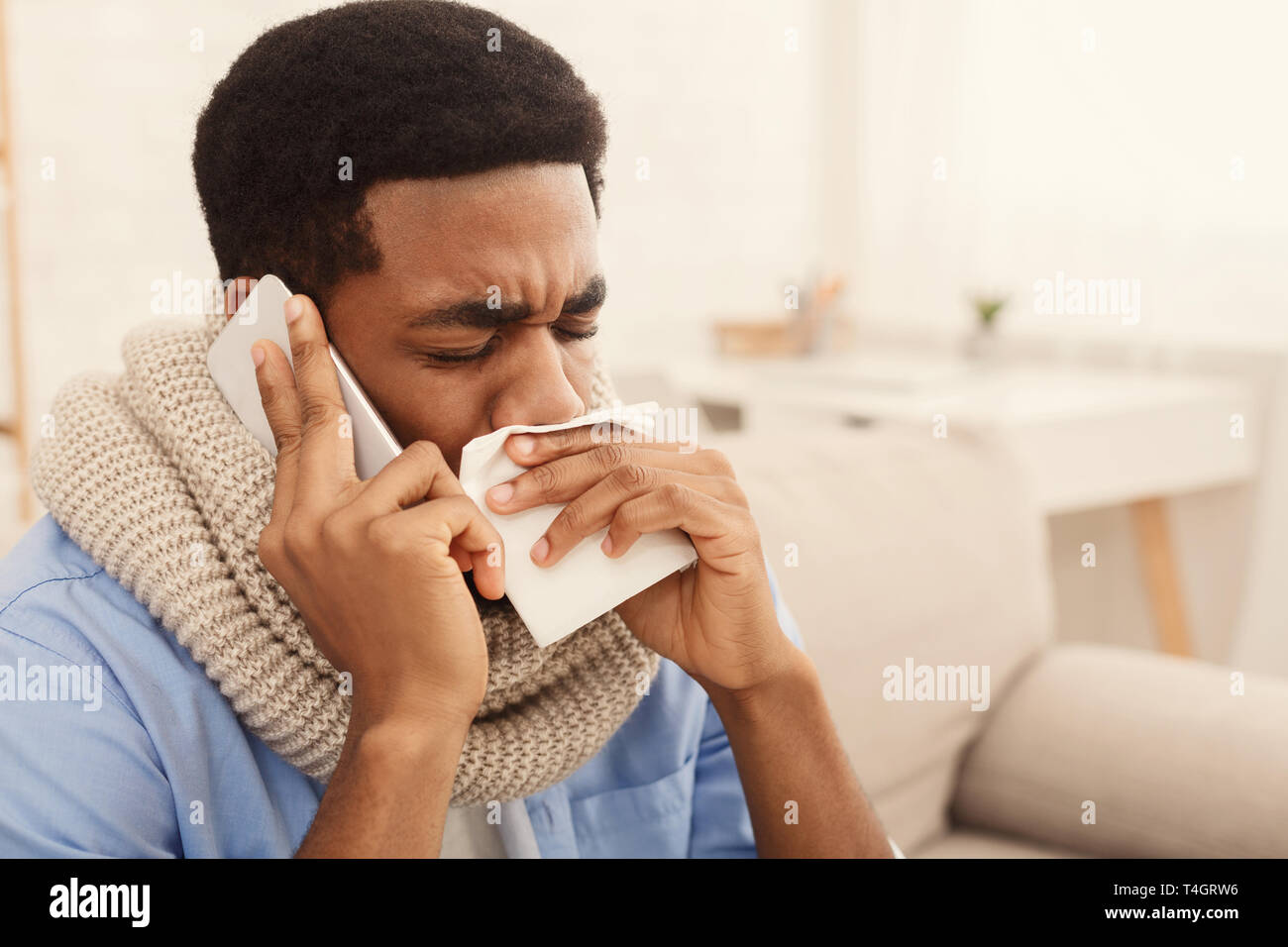 Sick black man calling on phone. to doctor Stock Photo - Alamy