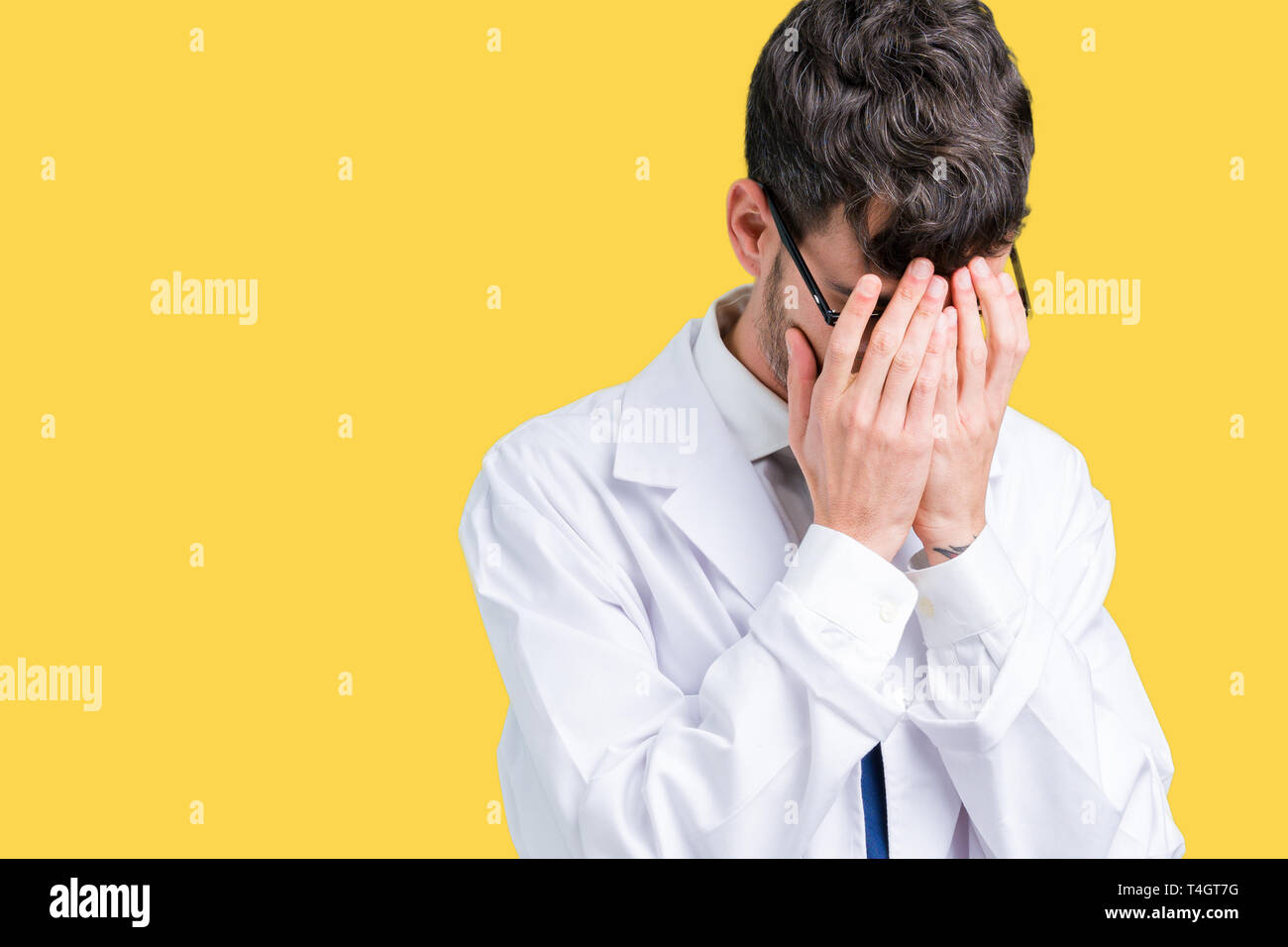 Young professional scientist man wearing white coat over isolated ...