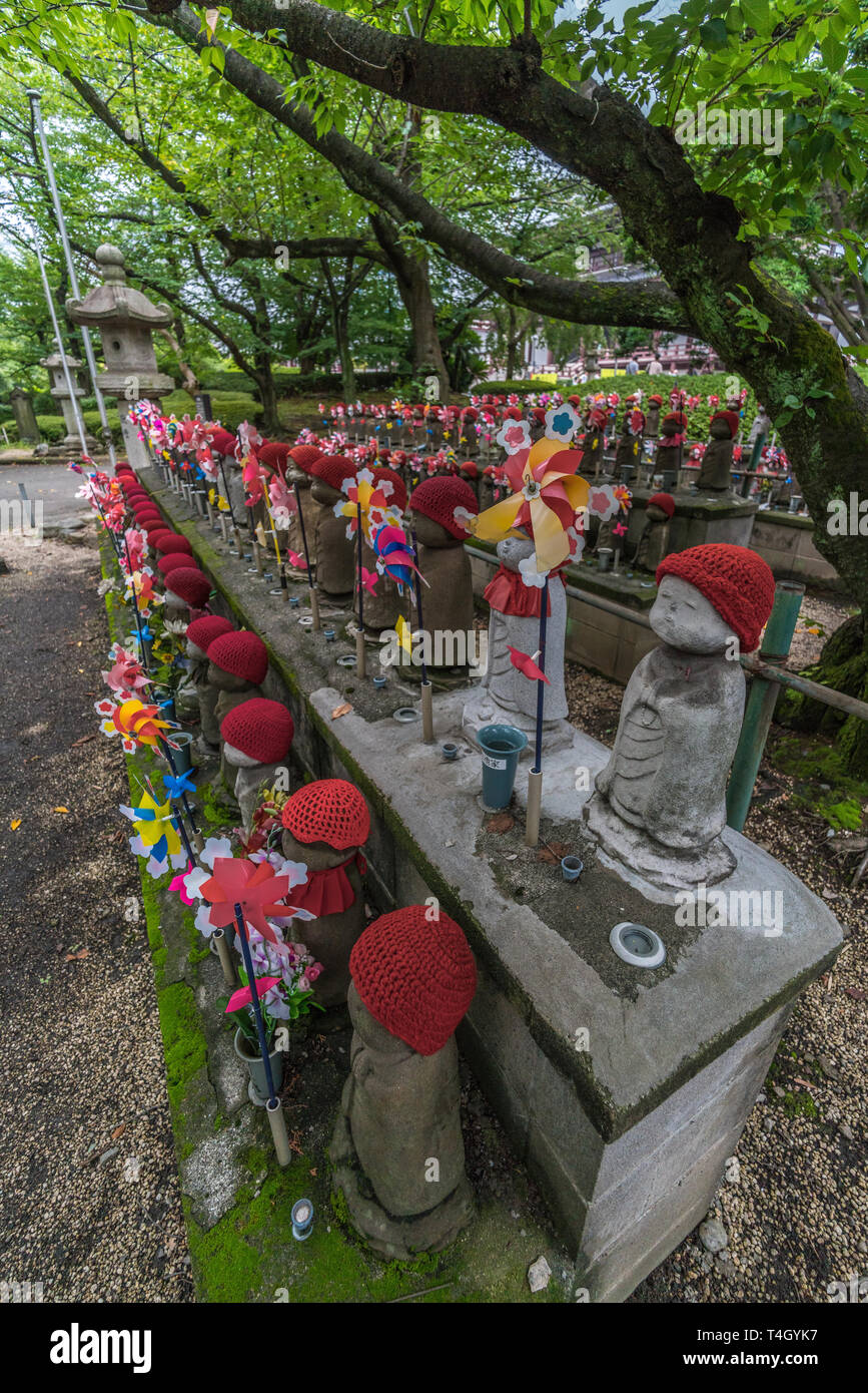Senda Kosodate Jizo Son. Small statues of Jizo. Tthe Buddhist god ...